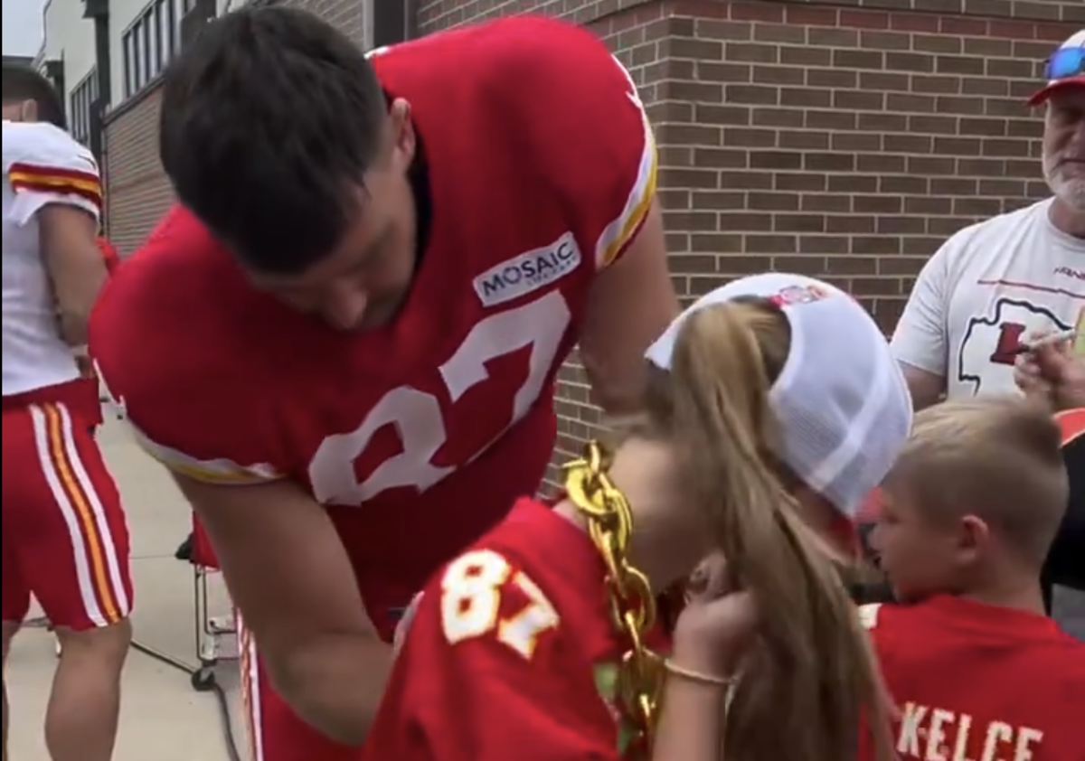 Young Chiefs fan steals the show at training camp after Travis Kelce signs custom Taylor Swift ...