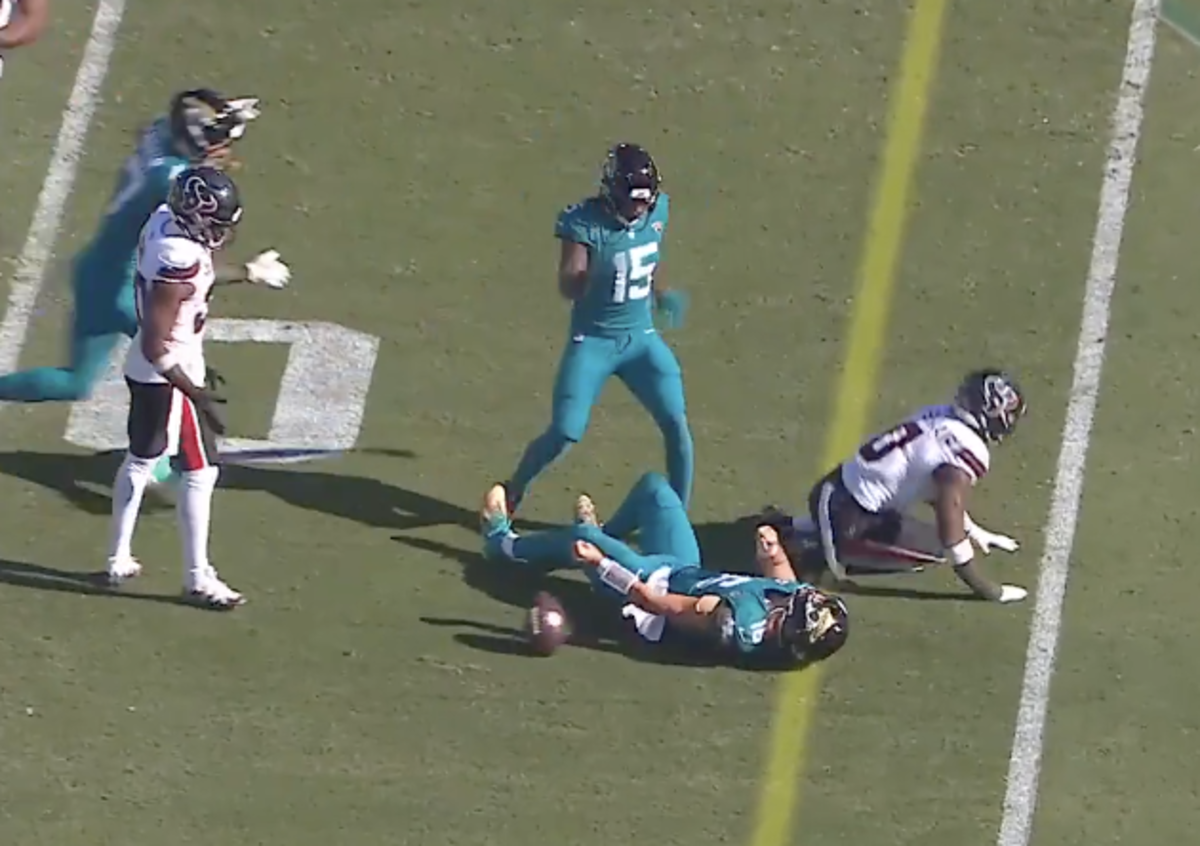 Jaguars QB Trevor Lawrence carted off after hard hit from Texans ...