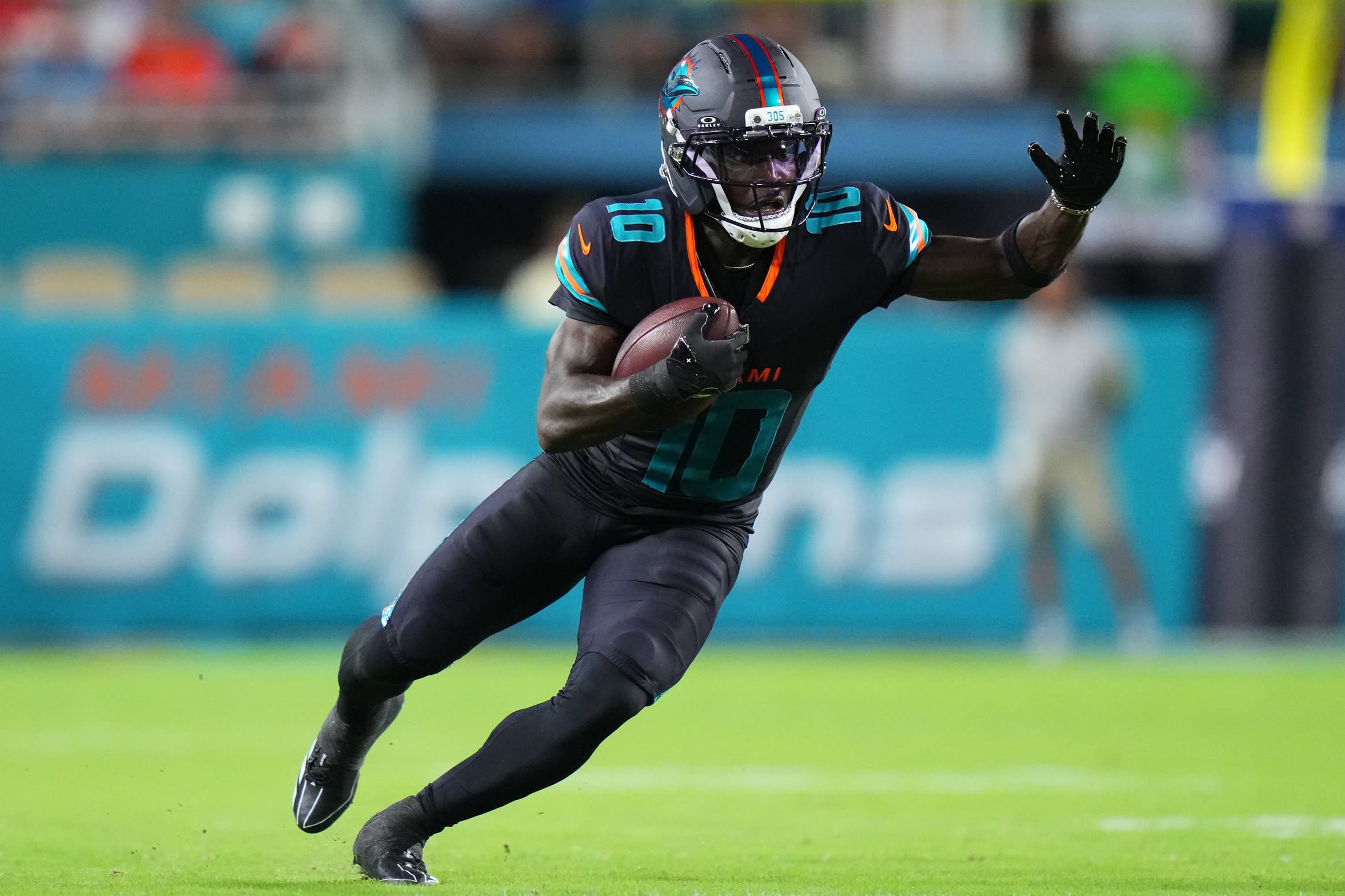 Dolphins’ quest for a first win in Week 4 takes a nightmare turn as Tyreek Hill is carted off ...